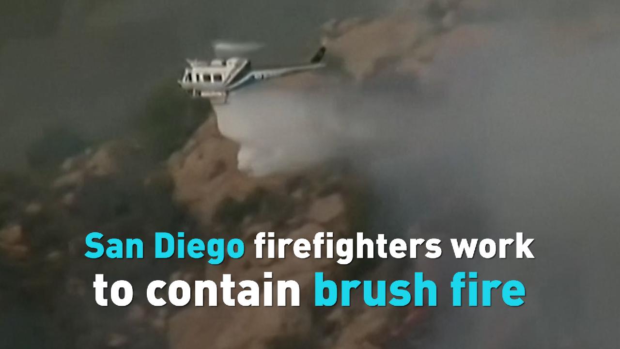 San Diego firefighters work to contain brush fire - CGTN