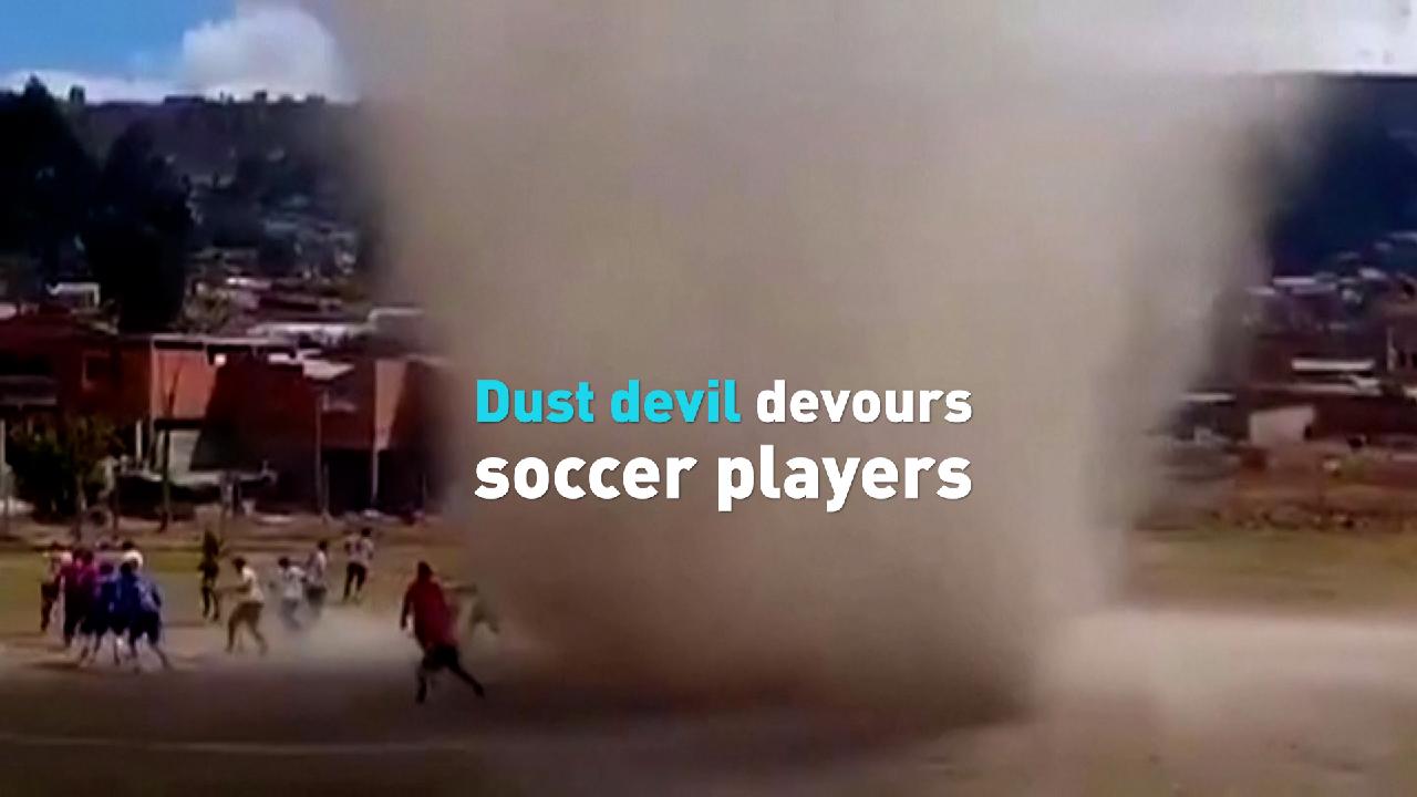 Watch soccer players swallowed by 'dust devil' - CGTN